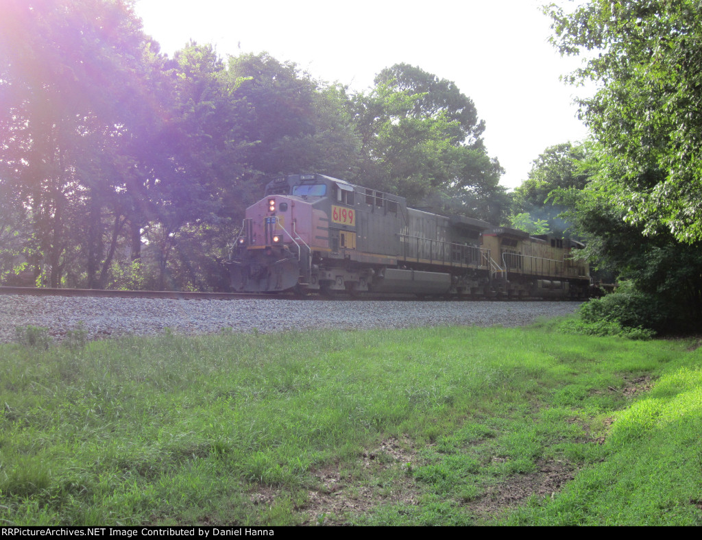 Patched SP unit leads NS 25Q at sunrise